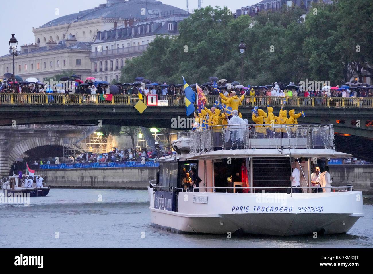 Members of Team Sweden float along the Seine River in Paris, France ...