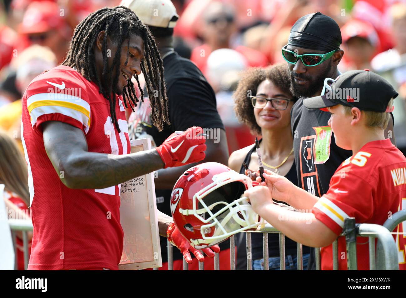 Kansas City Chiefs running back Isiah Pacheco (10) signs autographs for ...