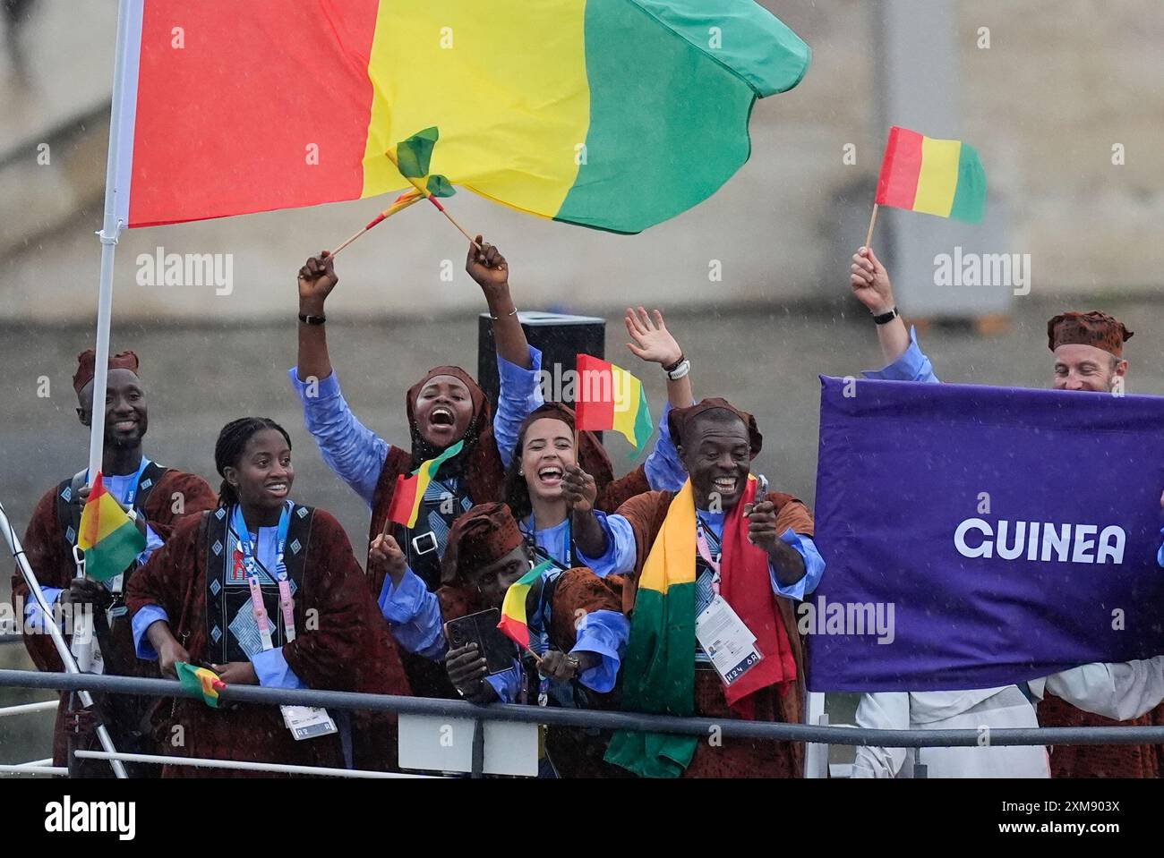 The boat carrying team Guinea makes its way down the Seine in Paris ...