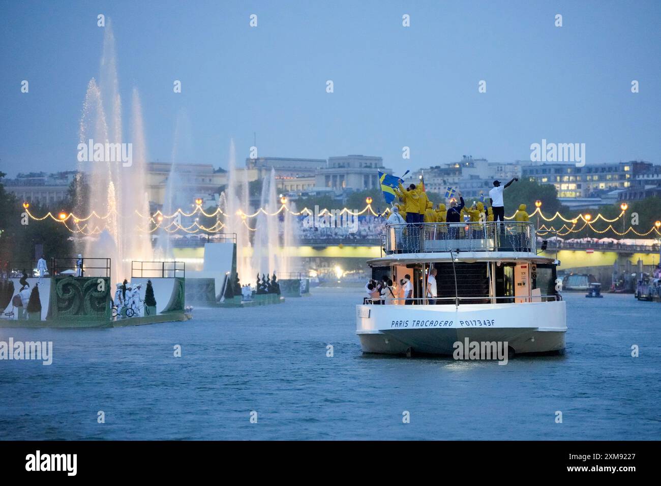 Members of Team Sweden float along the Seine River in Paris, France ...