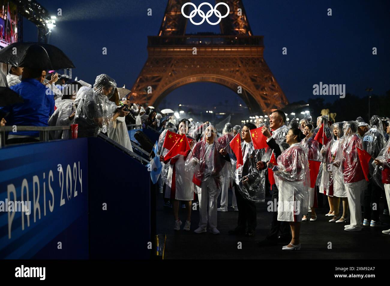 Members of China's delegation arrive at the Trocadero as the Eiffel ...