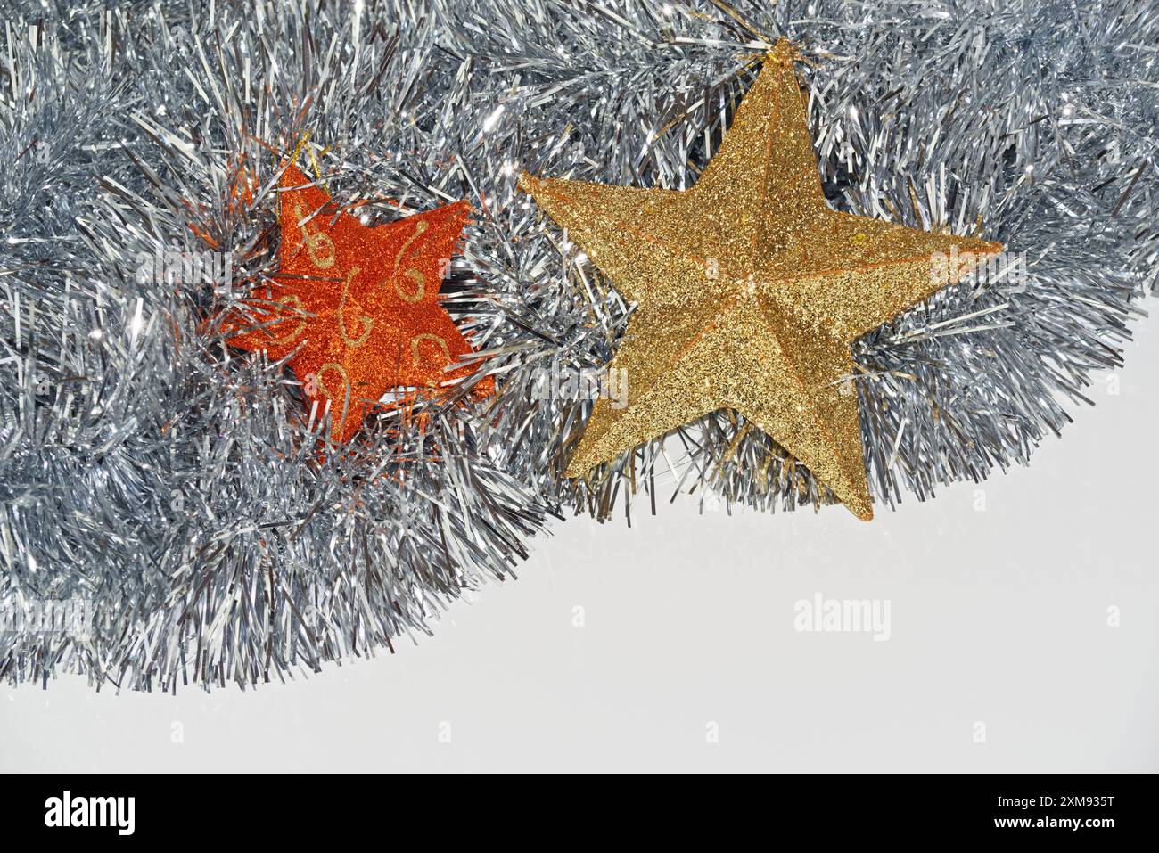 Christmas decoration from two stars in orange and golden colors lying ...