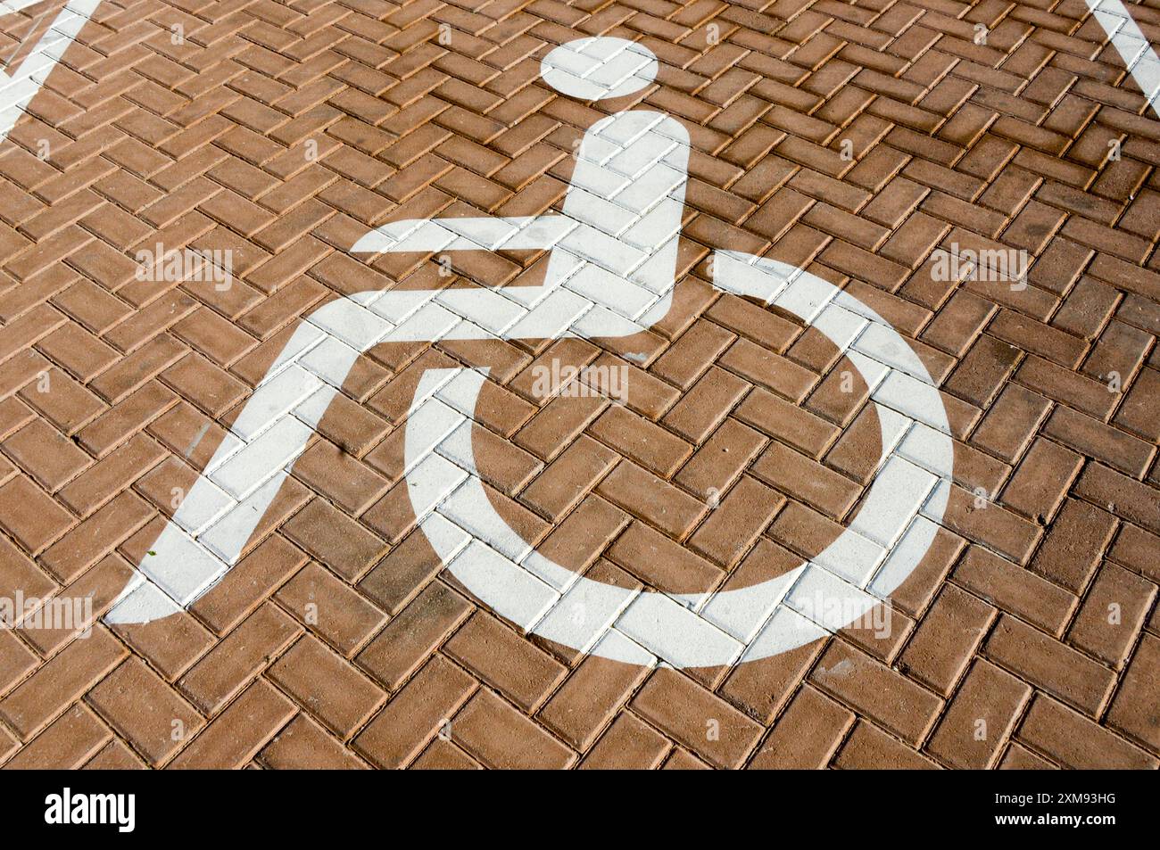 disabled only horizontal parking sign on a yellow bricks pavement Stock ...