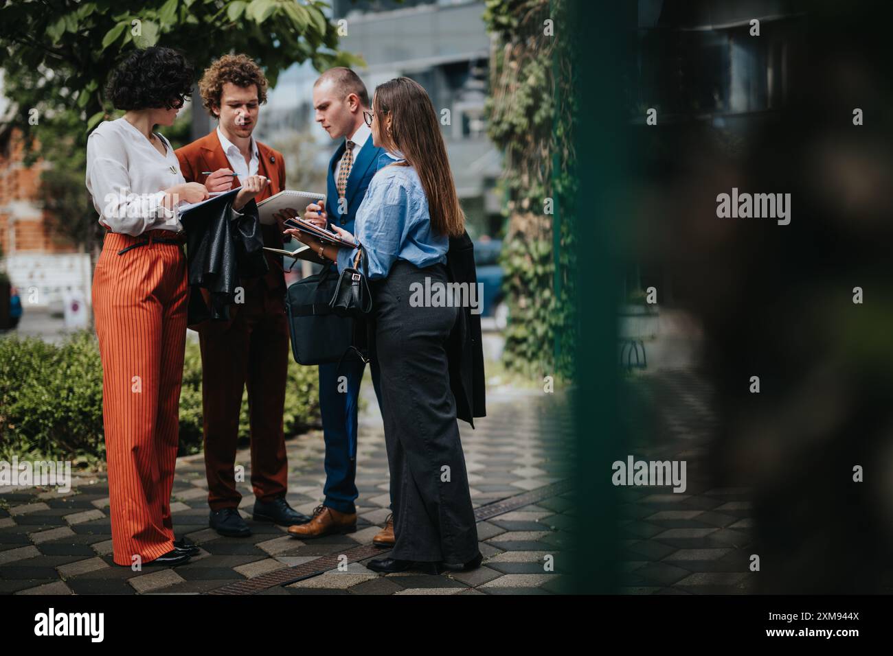Team brainstorming session in an outdoor business meeting setting Stock ...
