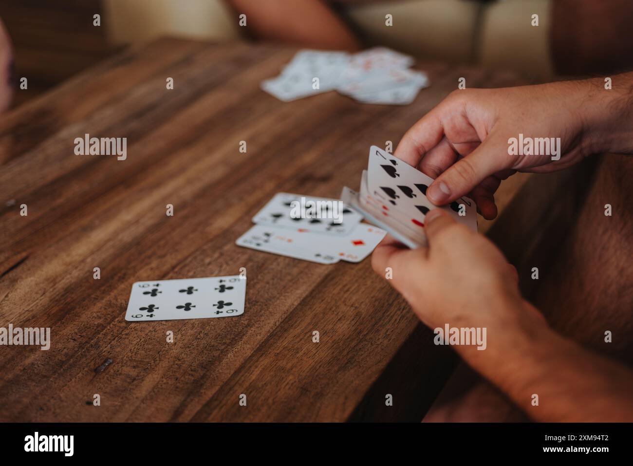 Group teens playing cards together hi-res stock photography and images ...
