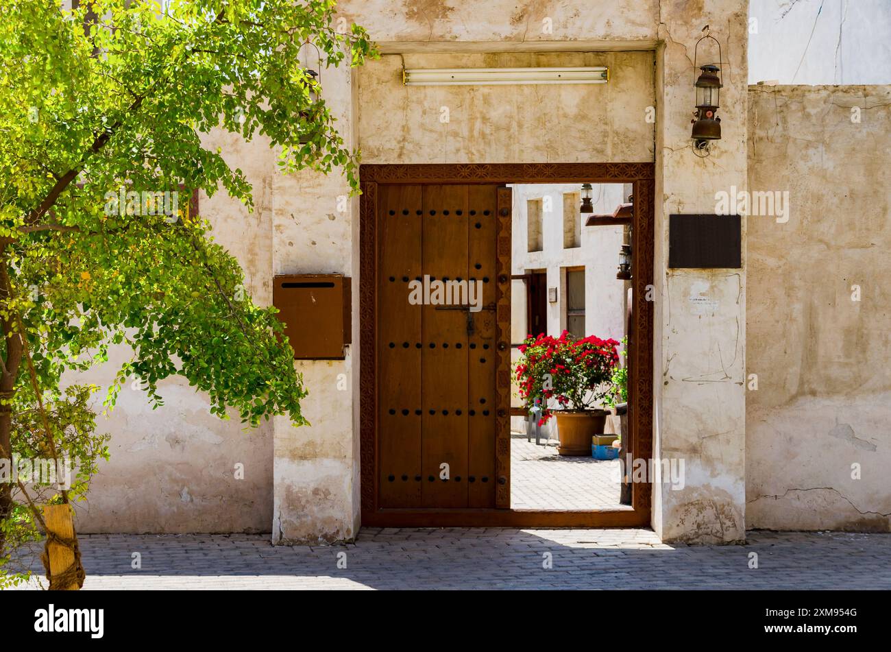 Traditional Arabic architecture gate leading to a patio in Old Dubai ...