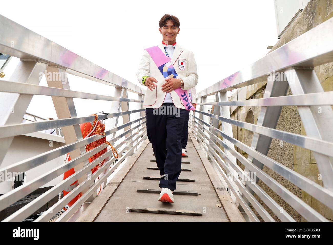 Shigekix, flag bearer for Japan, makes his way to a boat prior to the ...