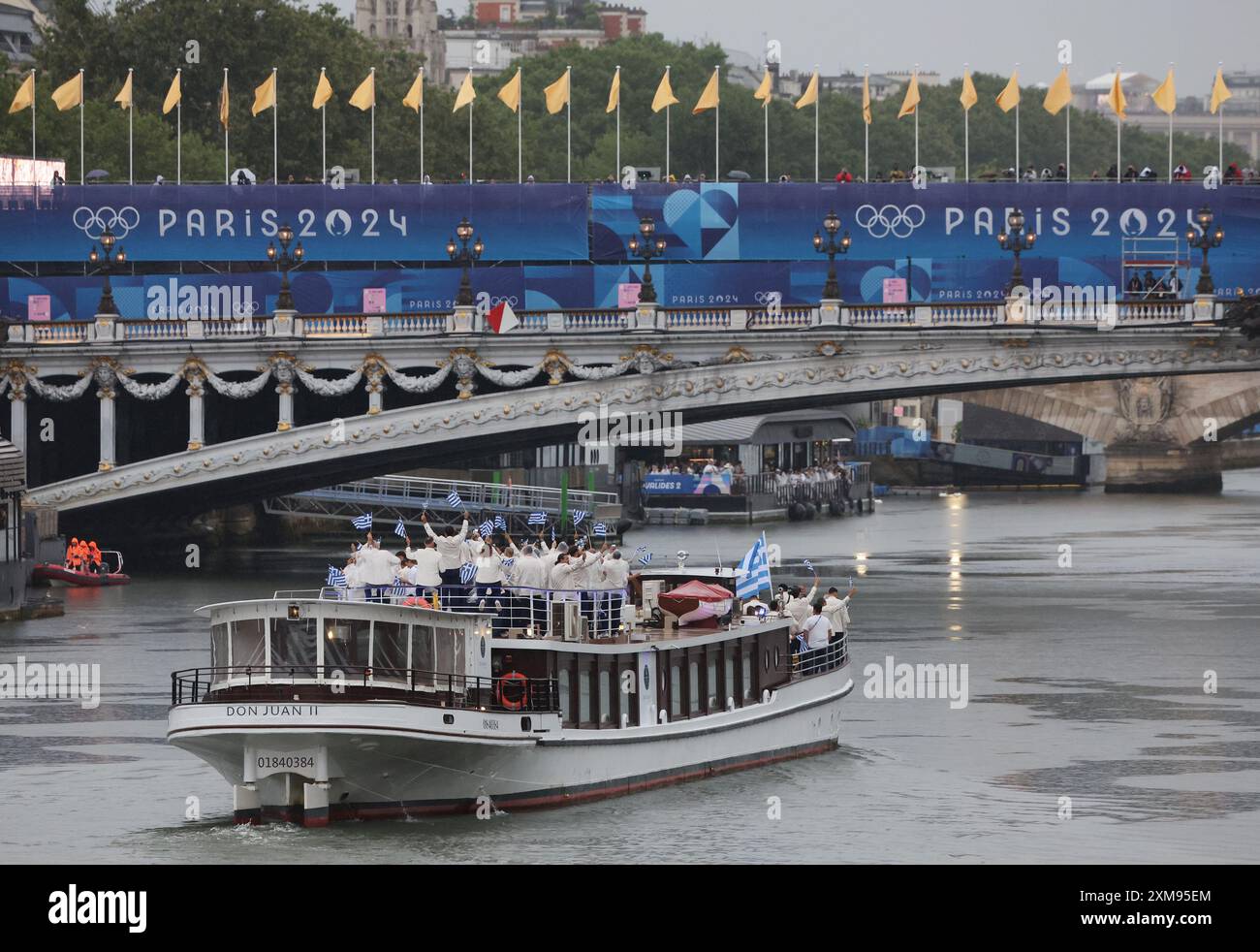 Paris, France. 26th July, 2024. A boat carrying athletes from Greece ...