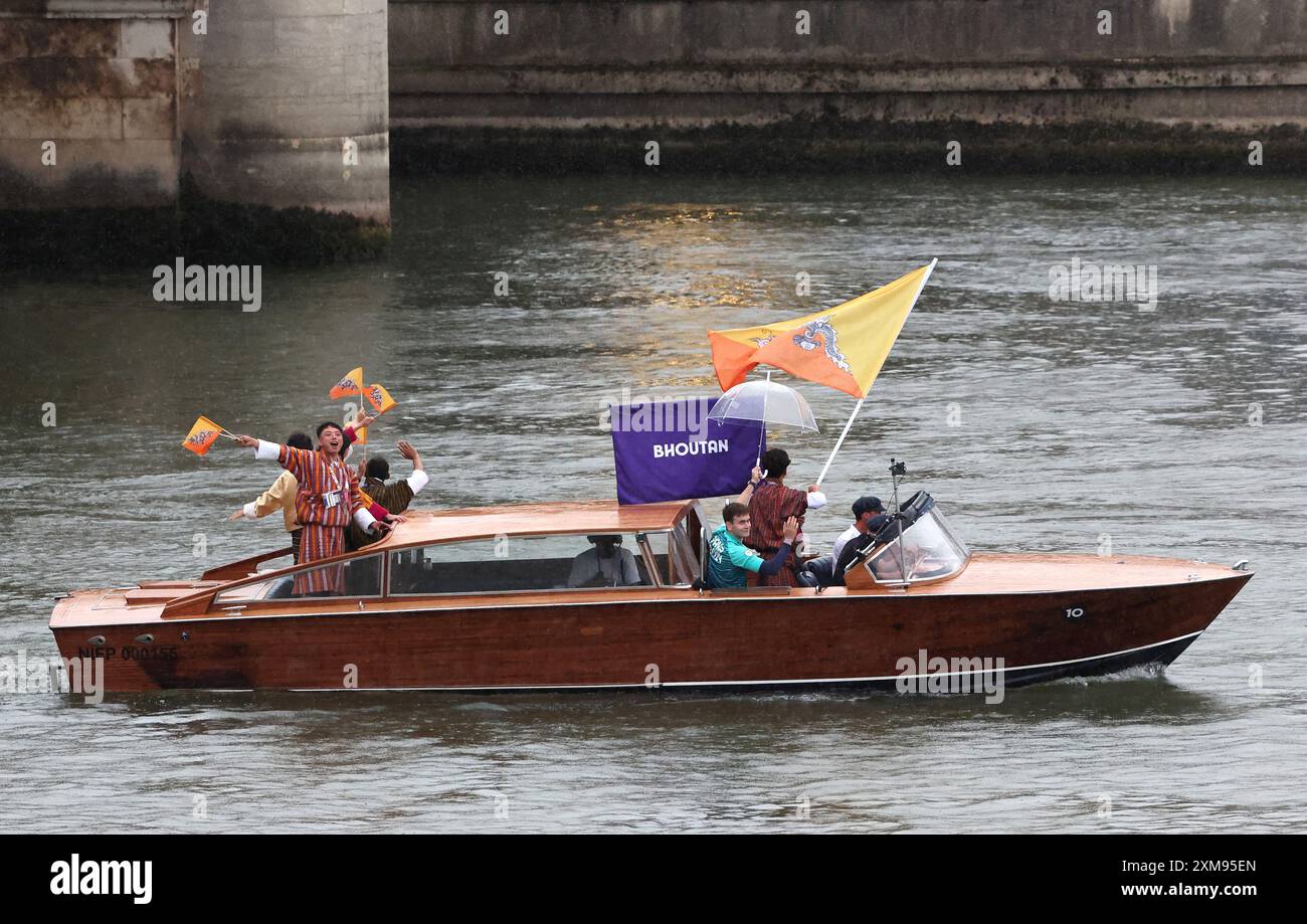 Paris, France. 26th July, 2024. A boat carrying athletes from Bhutan ...