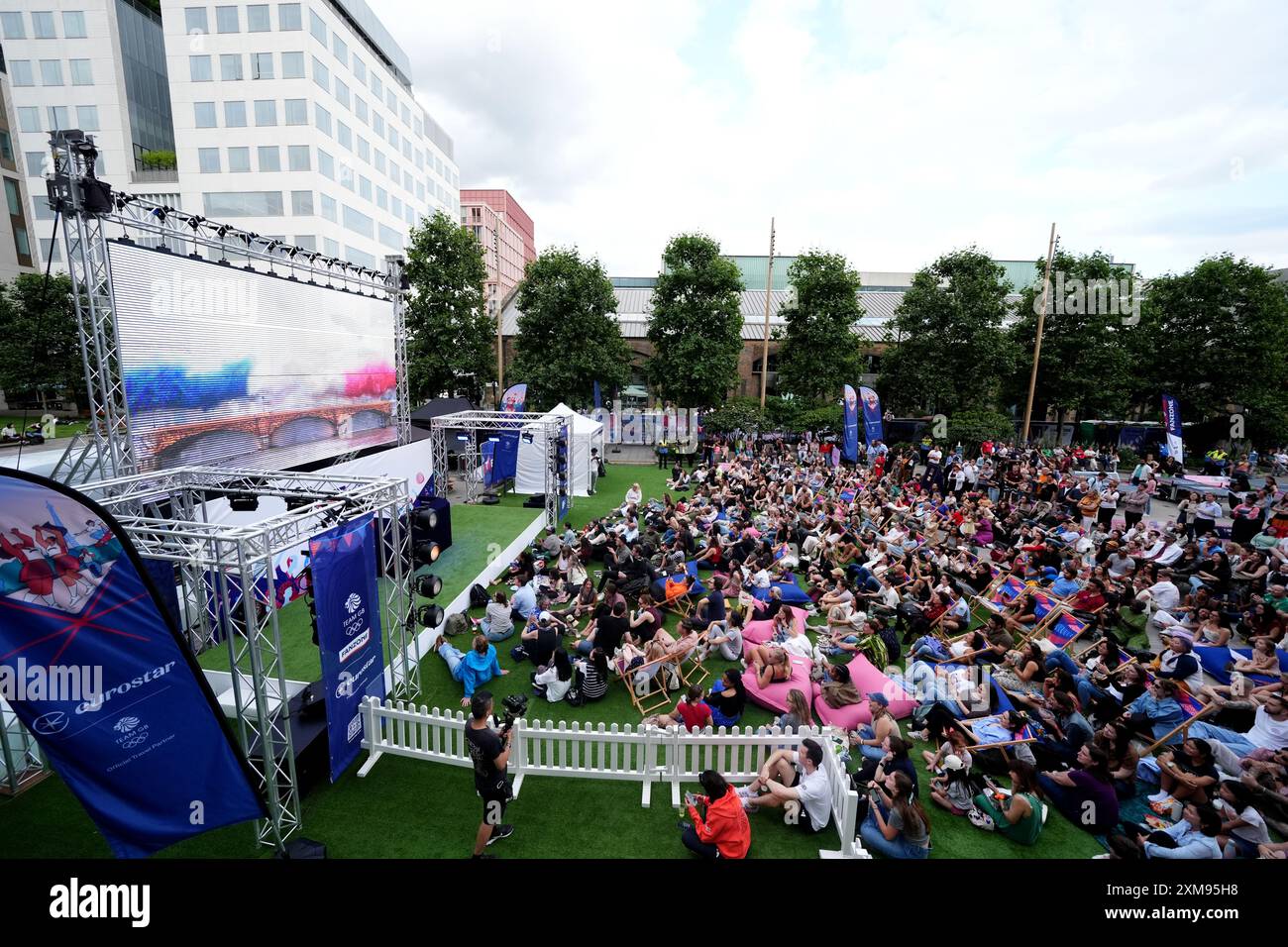 Fans start to watch the opening ceremony of the Paris 2024 Olympic ...