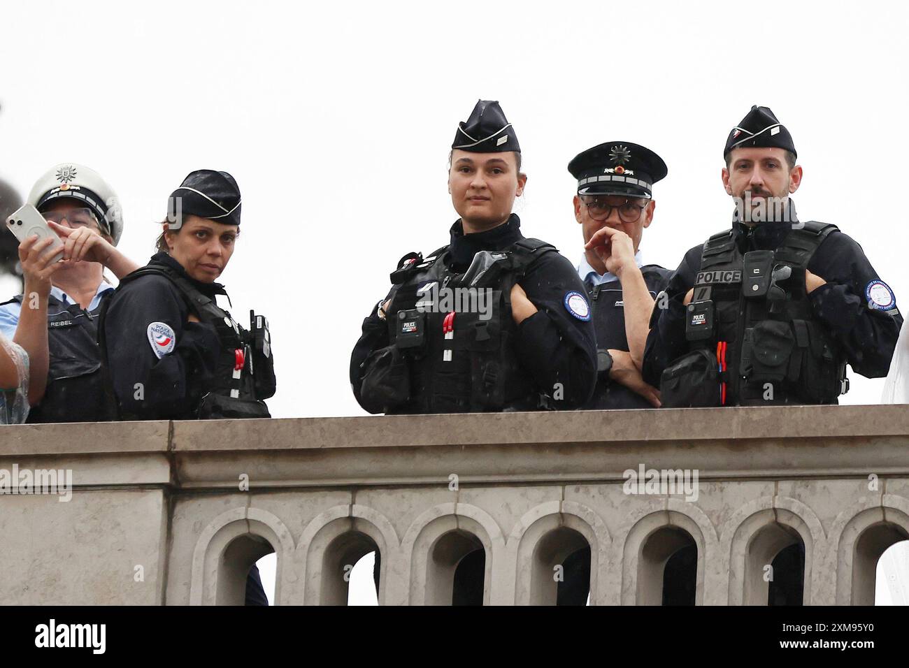 Police look on from a bridge during the opening ceremony of the 2024 ...