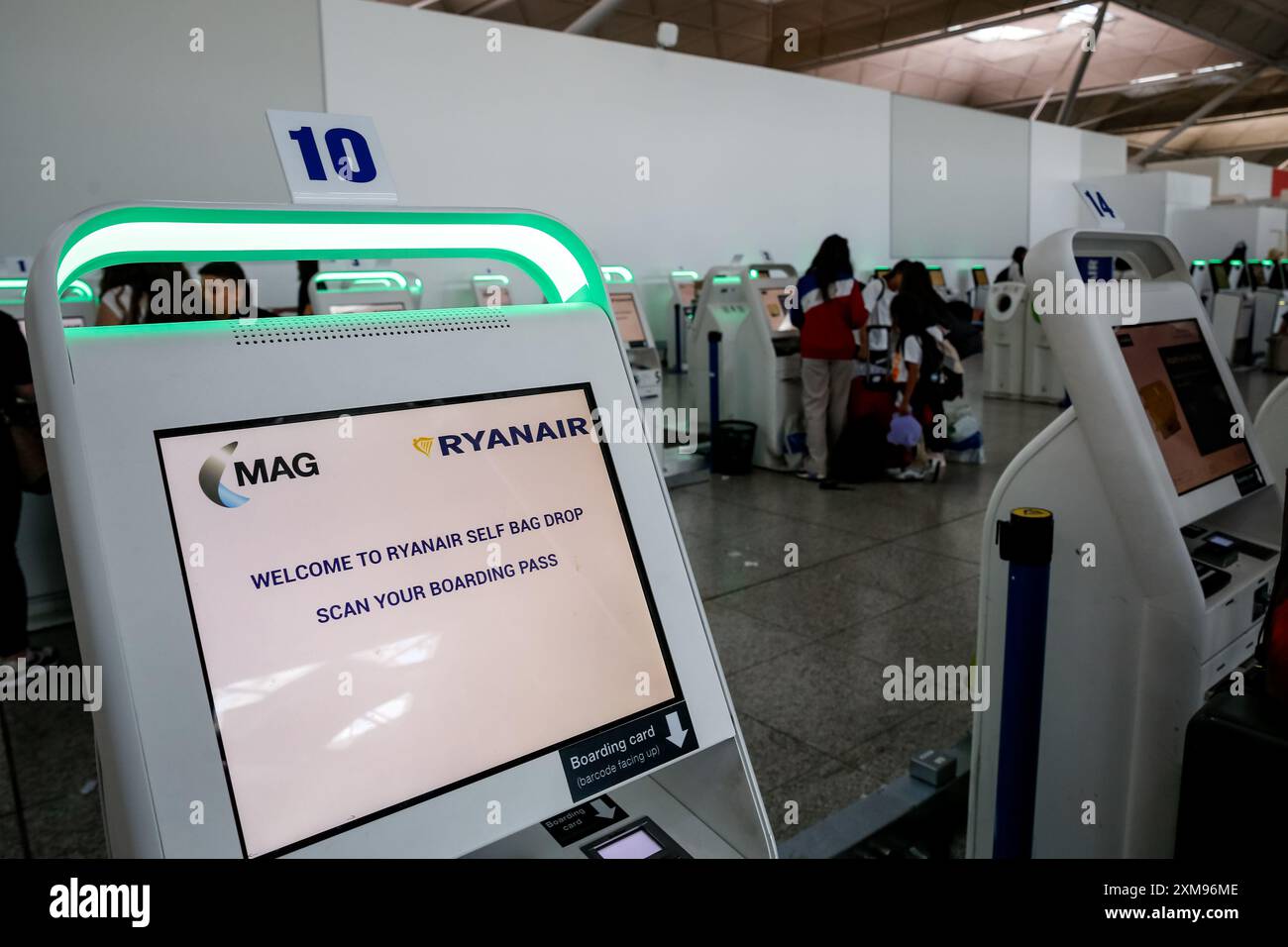 Self check in and self bag drop is seen at Ryanair check-in desk in ...
