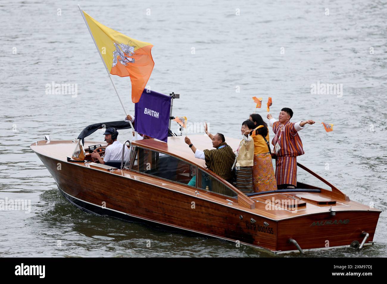 Kinzang Lhamo and Sangay Tenzin, Flagbearers of Bhutan, wave the ...