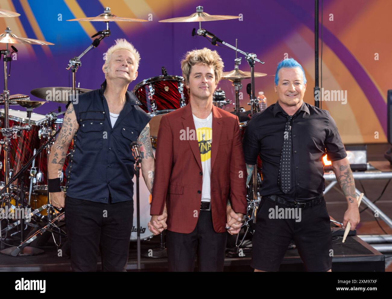 Mike Dirnt, Billie Joe Armstrong, Tre Cool pose on stage during ABC ...