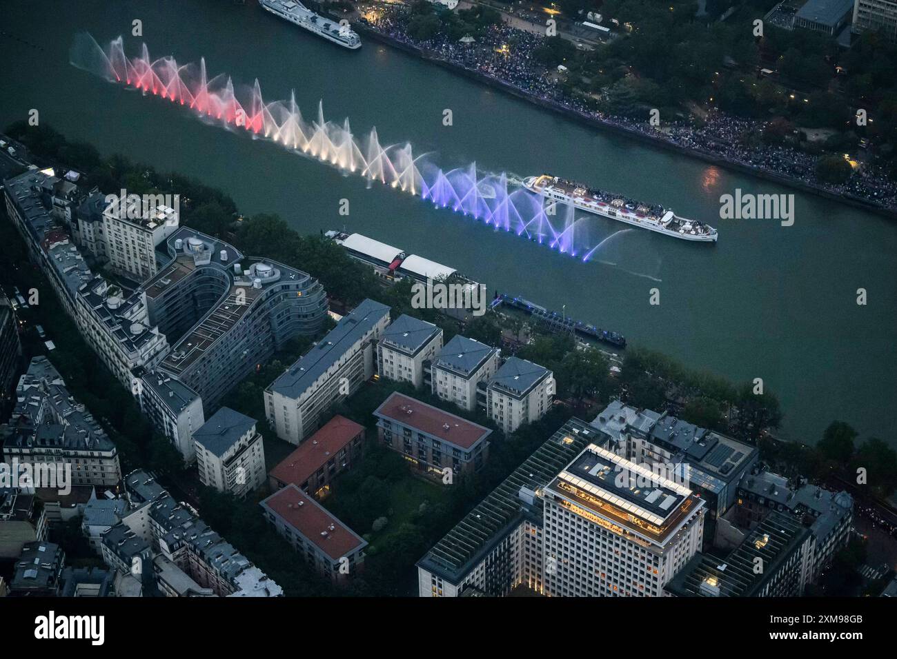 A delegation boat makes its way along the Seine in Paris, France ...