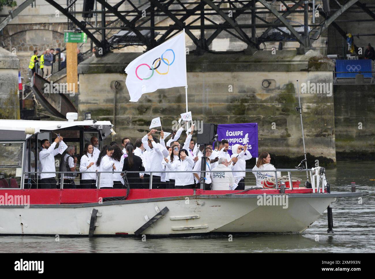 Refugee Olympic Team athletes aboard a boat sail the River Seine during ...