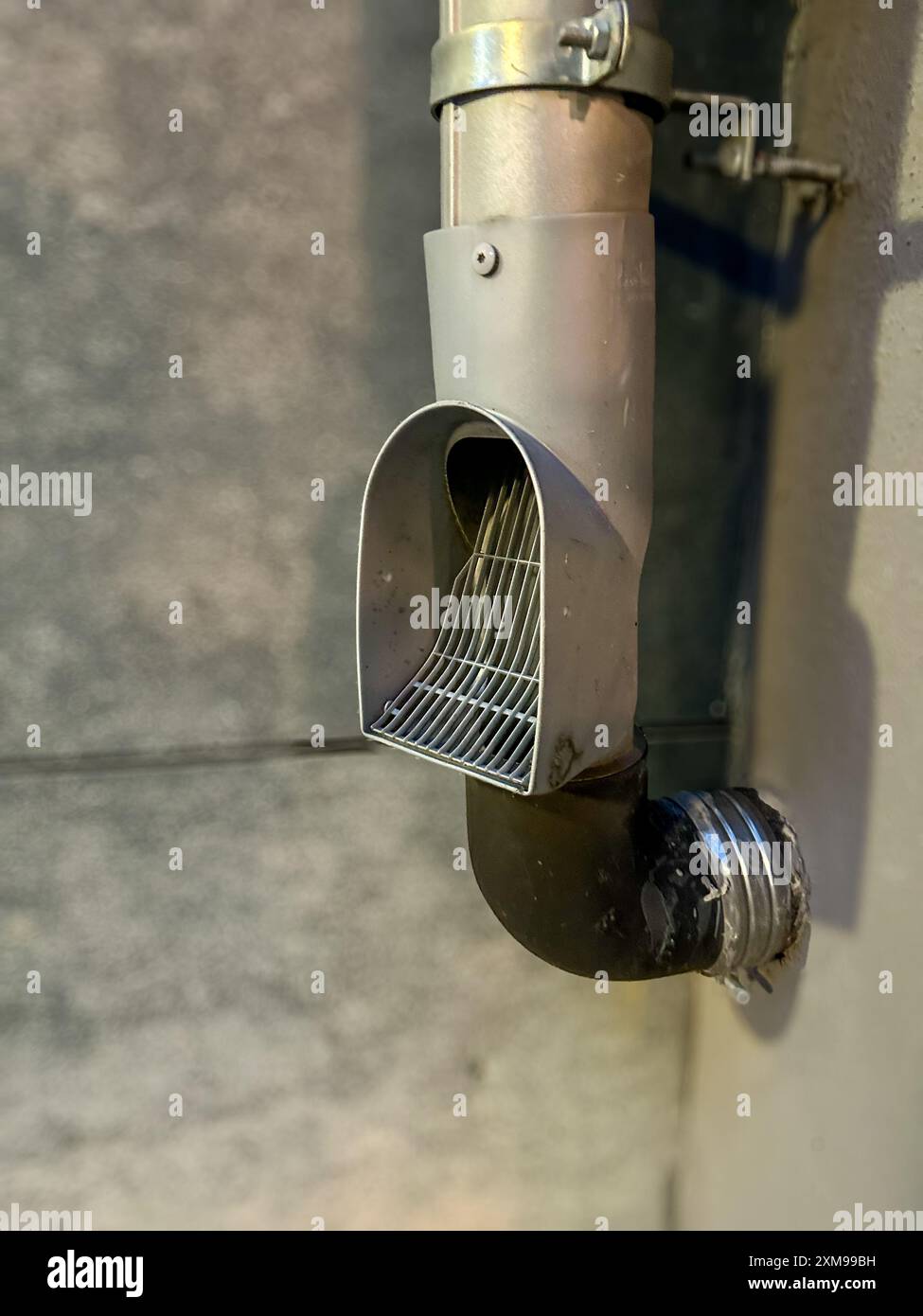 Water drains from the drain pipe into a metal container Stock Photo - Alamy