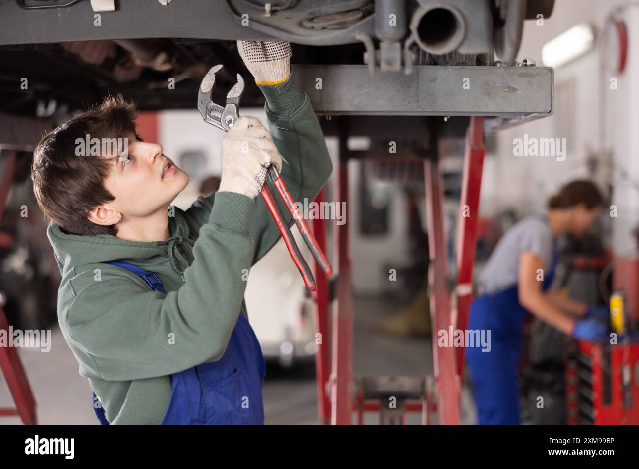 Male working car engine transportation automotive repairs hi-res stock ...