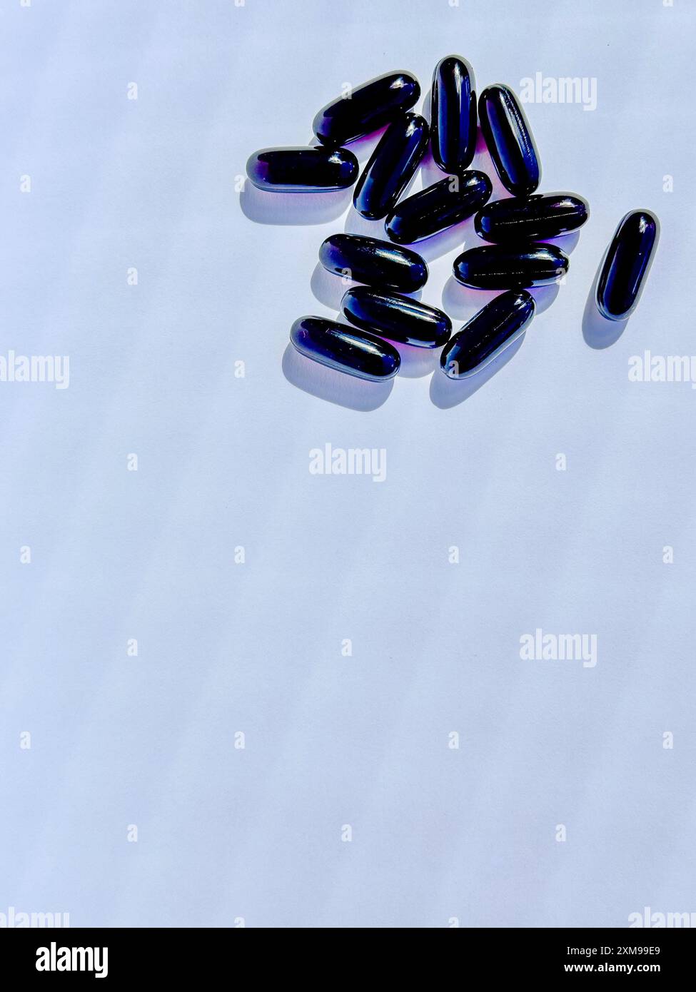Blue capsules or pills isolated on white background Stock Photo - Alamy