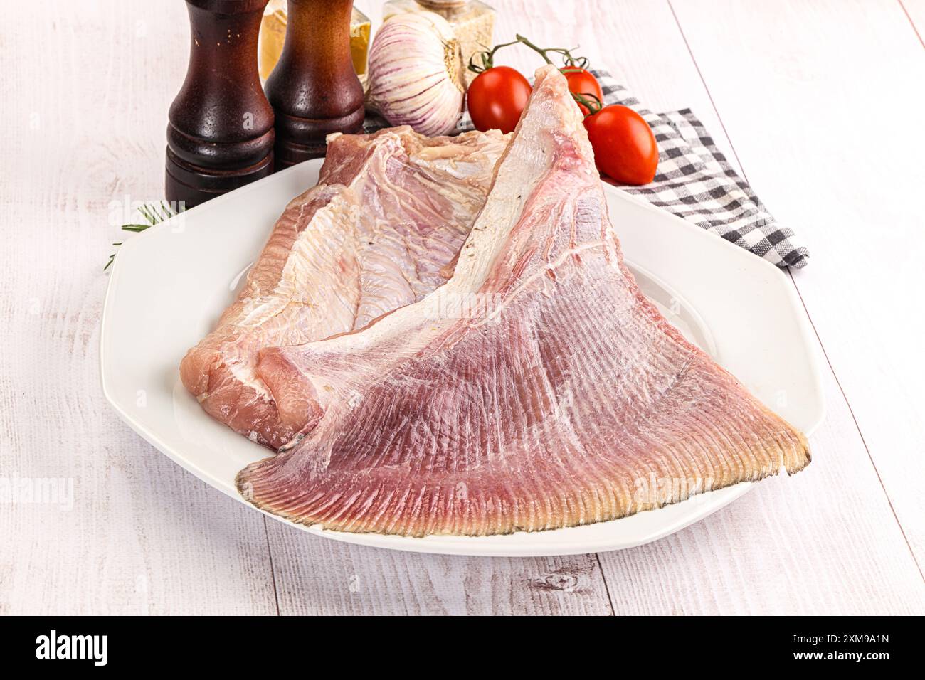 Raw uncooked stingray fish wing in thw plate Stock Photo - Alamy