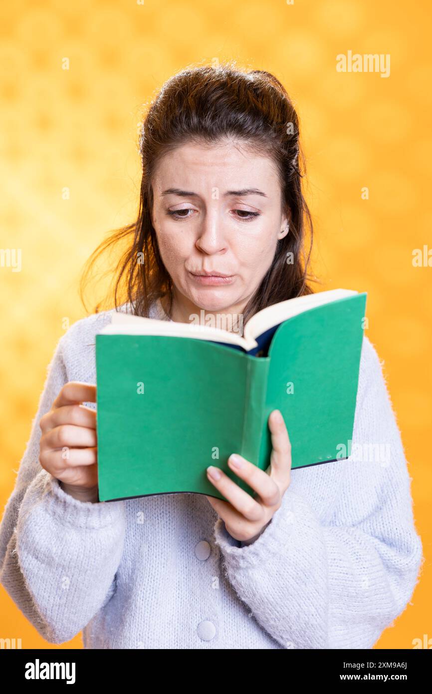 Woman with worried look on face biting lips from stress while gathering ...