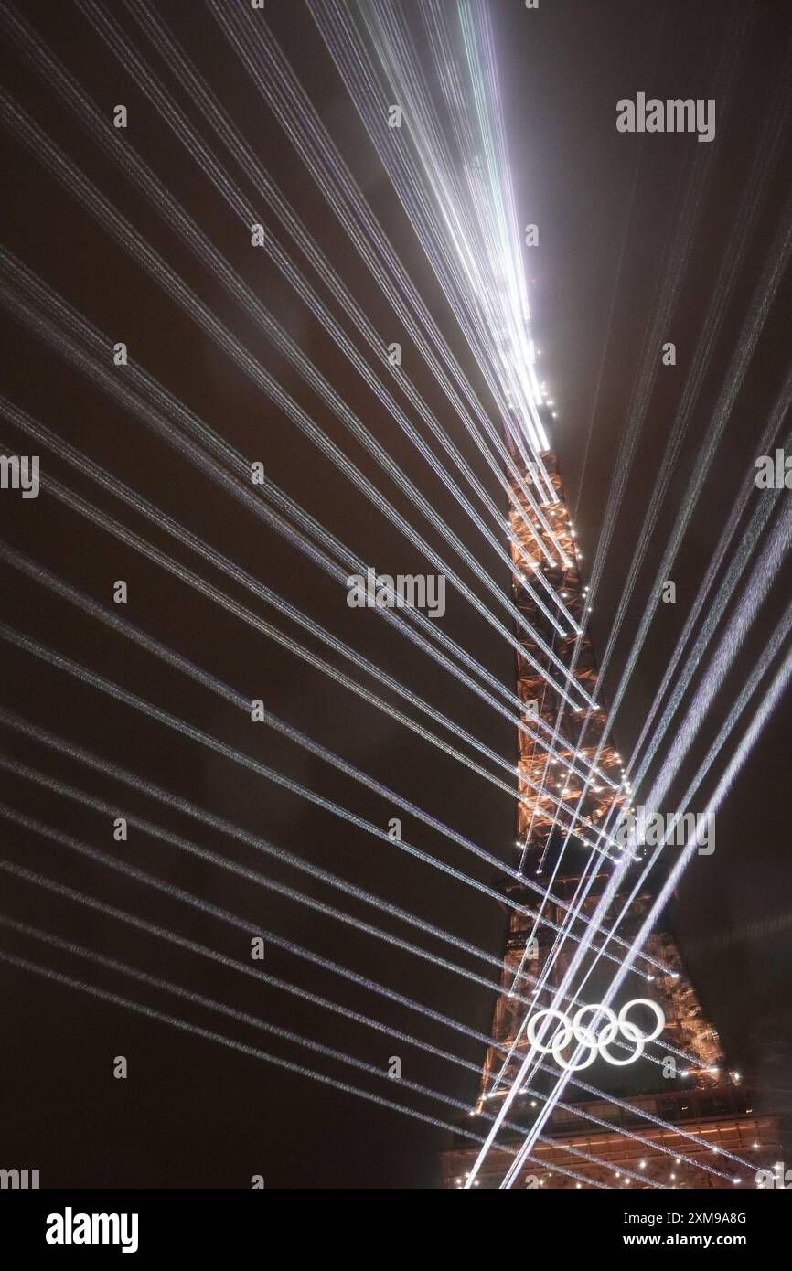 Paris, France. 26th July, 2024. A laser light show beams from the ...