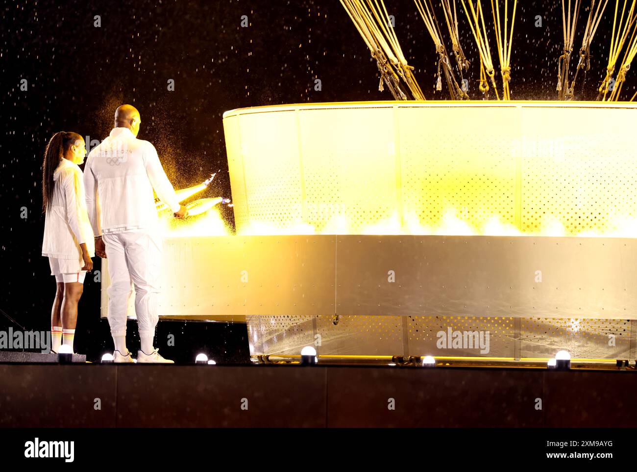 The Olympic flame is lit during the opening ceremony of the Paris 2024 ...