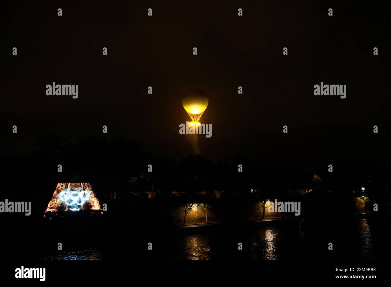The cauldron rises in a balloon in Paris, France, during the opening ...
