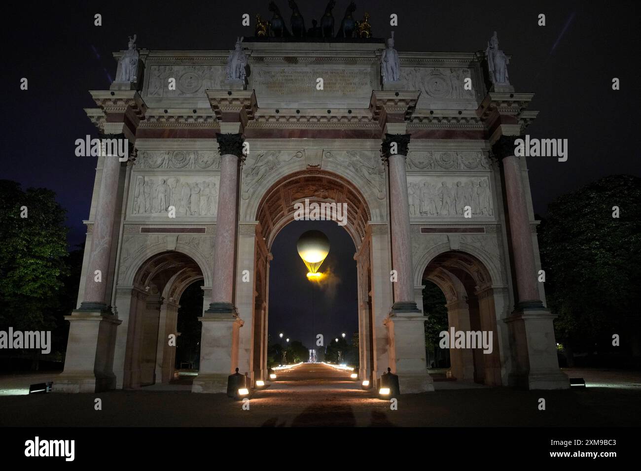 The the cauldron rises in a balloon seen through the Carrousel du ...