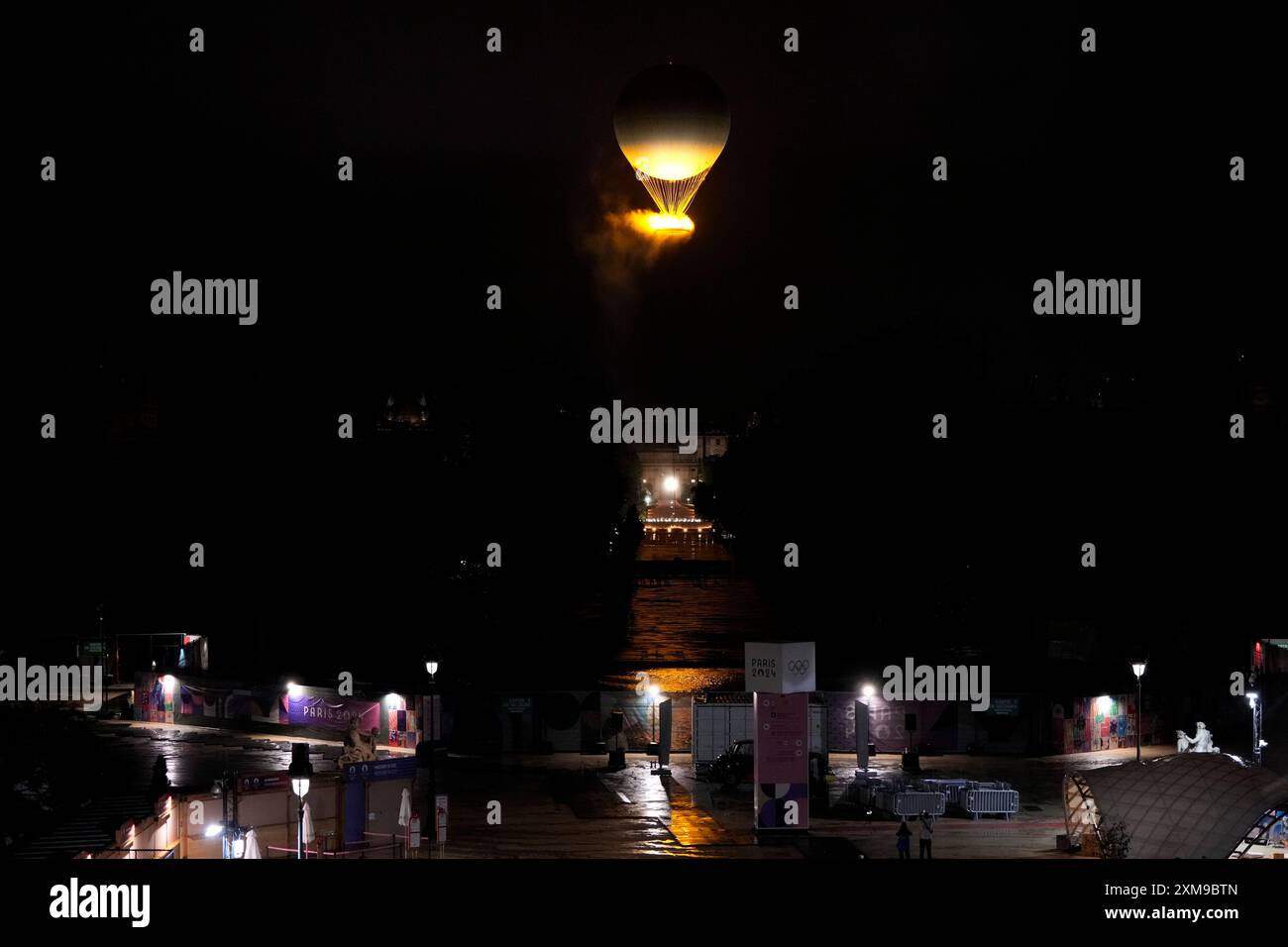The cauldron rises in a balloon in Paris, France, during the opening ...