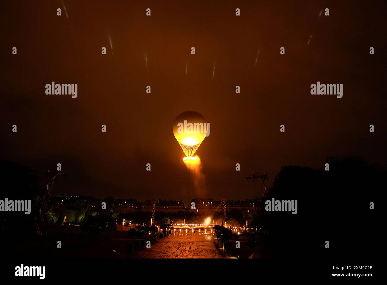 The Olympic Flame rises on a balloon after being lit in Paris, France ...