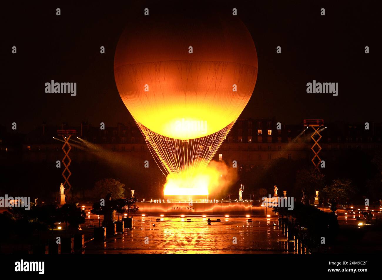 The Olympic Flame rises on a balloon after being lit in Paris, France ...