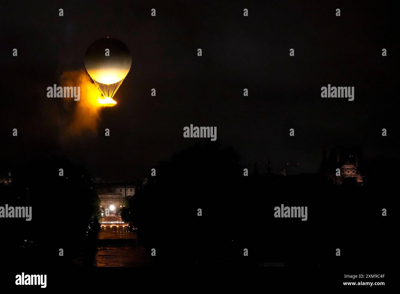 The cauldron rises in a balloon in Paris, France, during the opening ...