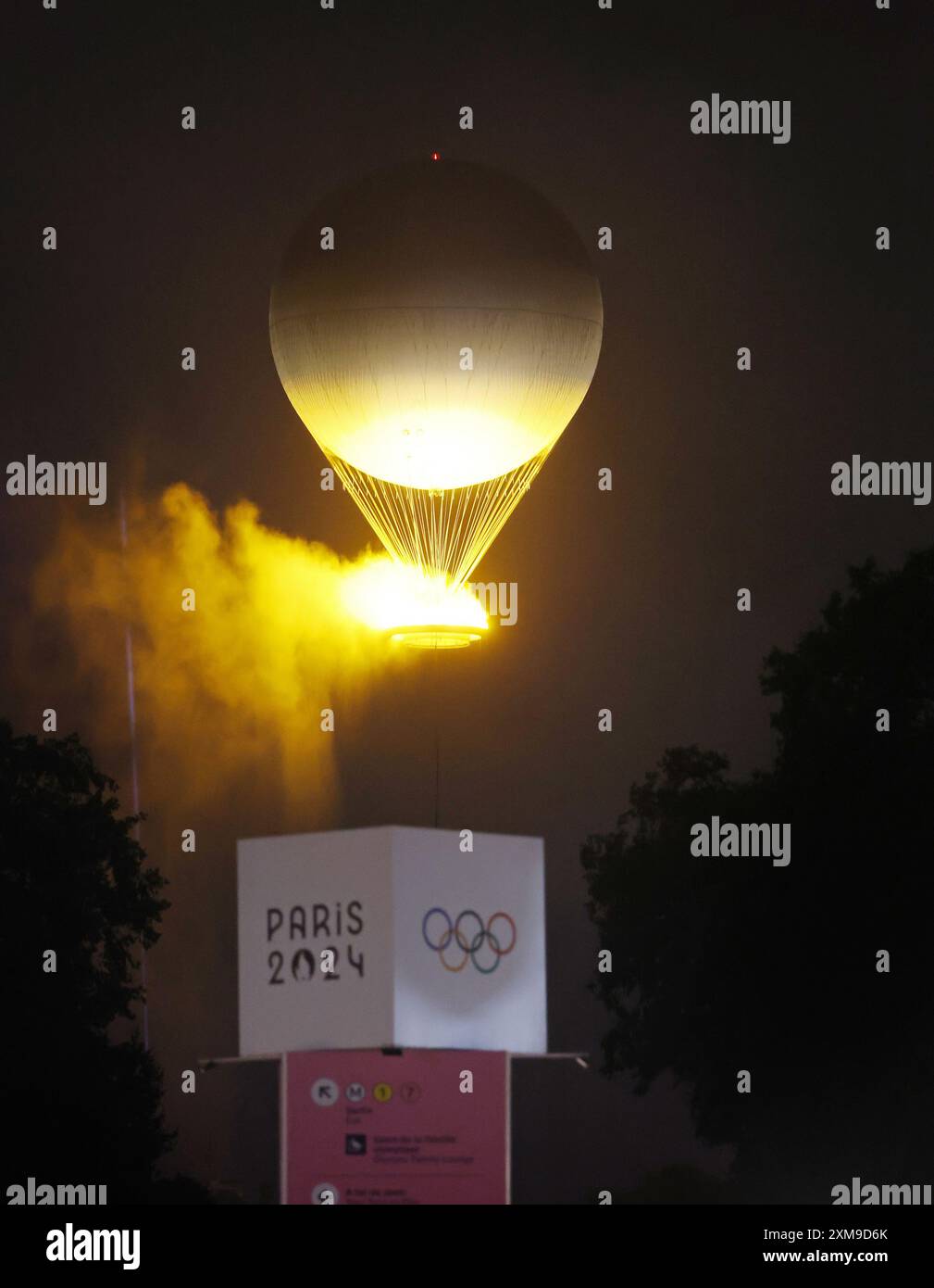 Paris, France. 26th July, 2024. A hot air balloon carrying the Olympic ...