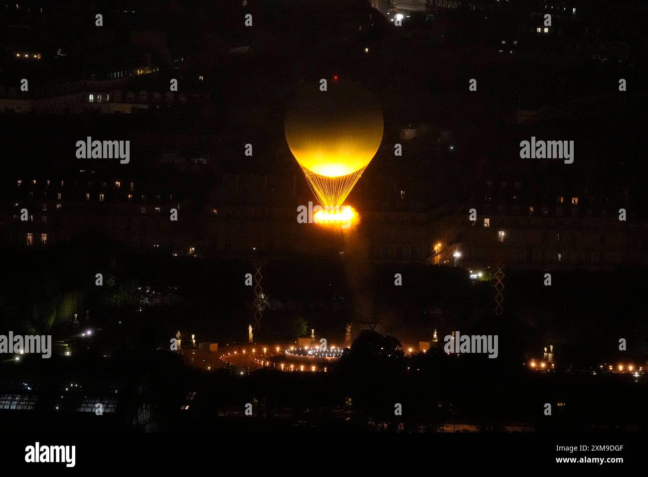 The Olympic Flame rises on a balloon after being lit in Paris, France ...