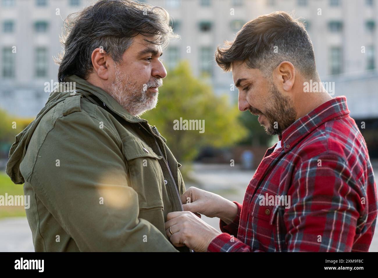 Two men adjusting hi-res stock photography and images - Alamy