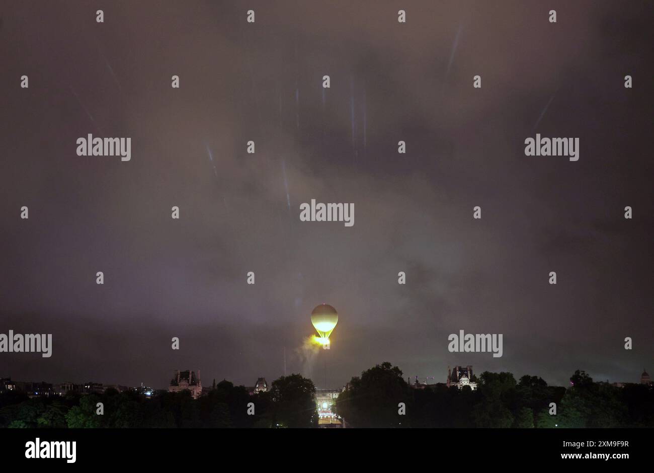 Paris, France. 26th July, 2024. A hot air balloon carrying the Olympic ...