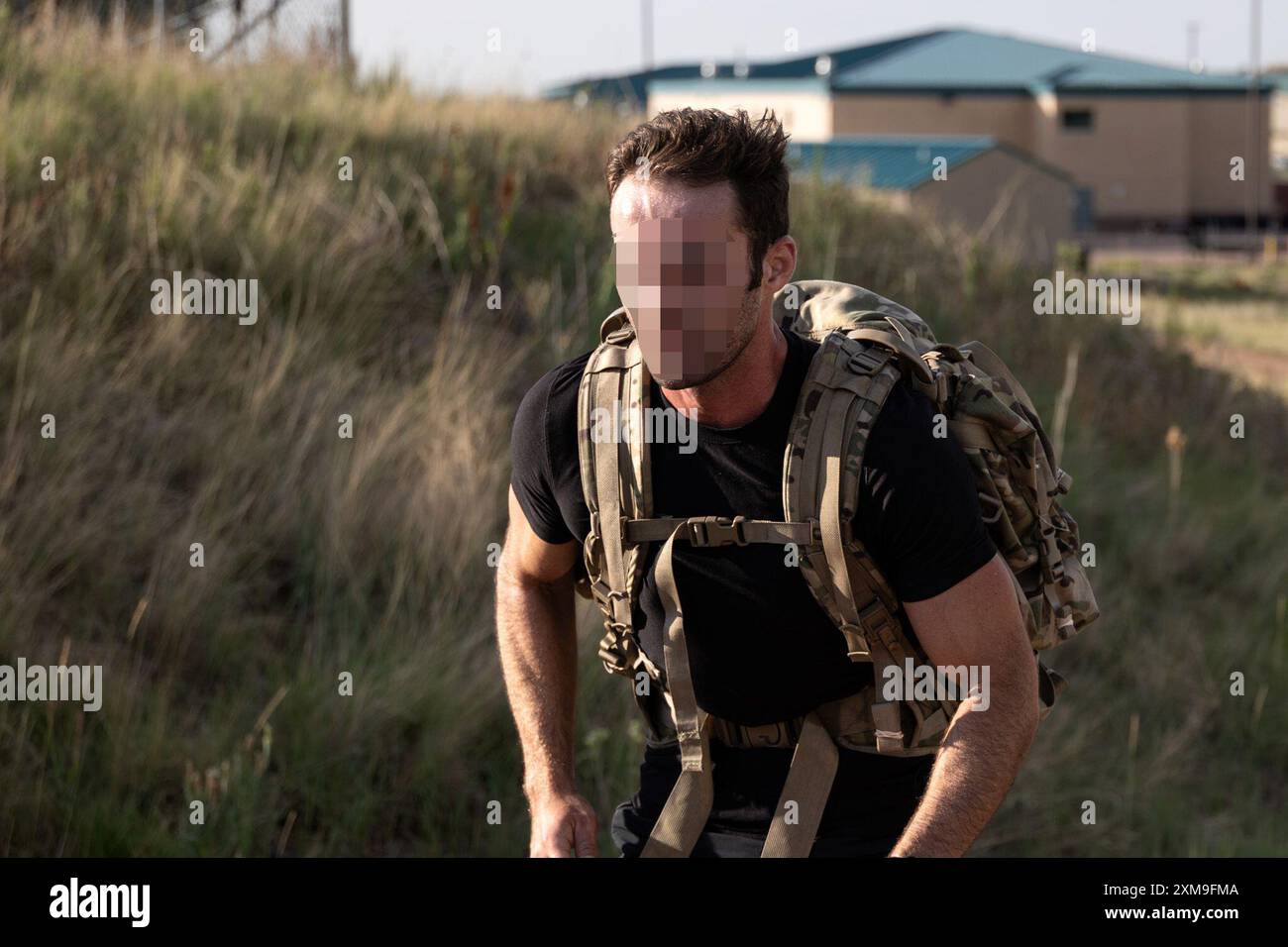 A Soldier with 10th Special Forces Group (Airborne) jogs towards the ...