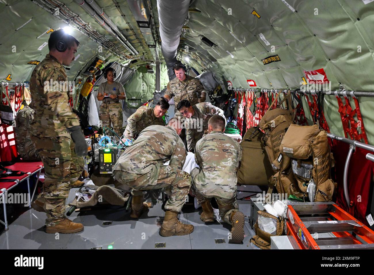 A group of 59th Medical Wing Airmen place a simulated patient and ...