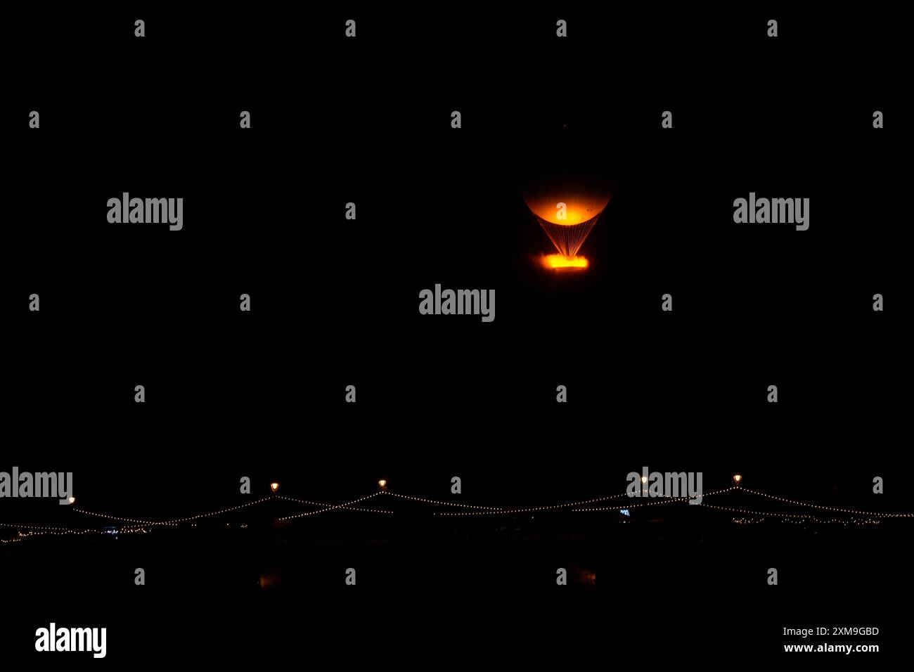 The cauldron rises in a balloon in Paris, France, during the opening ...