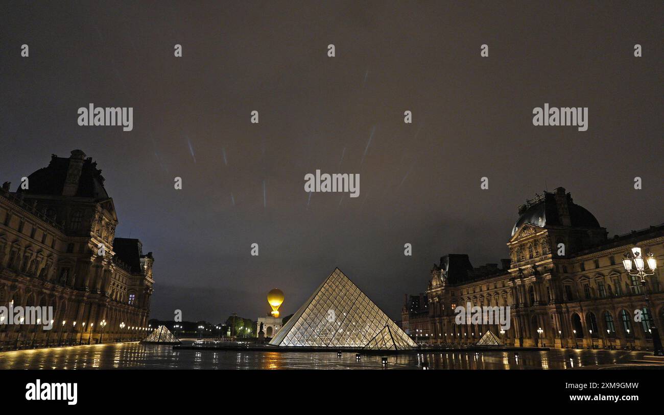 Paris, France. 26th July, 2024. A balloon carrying the lit Olympic ...