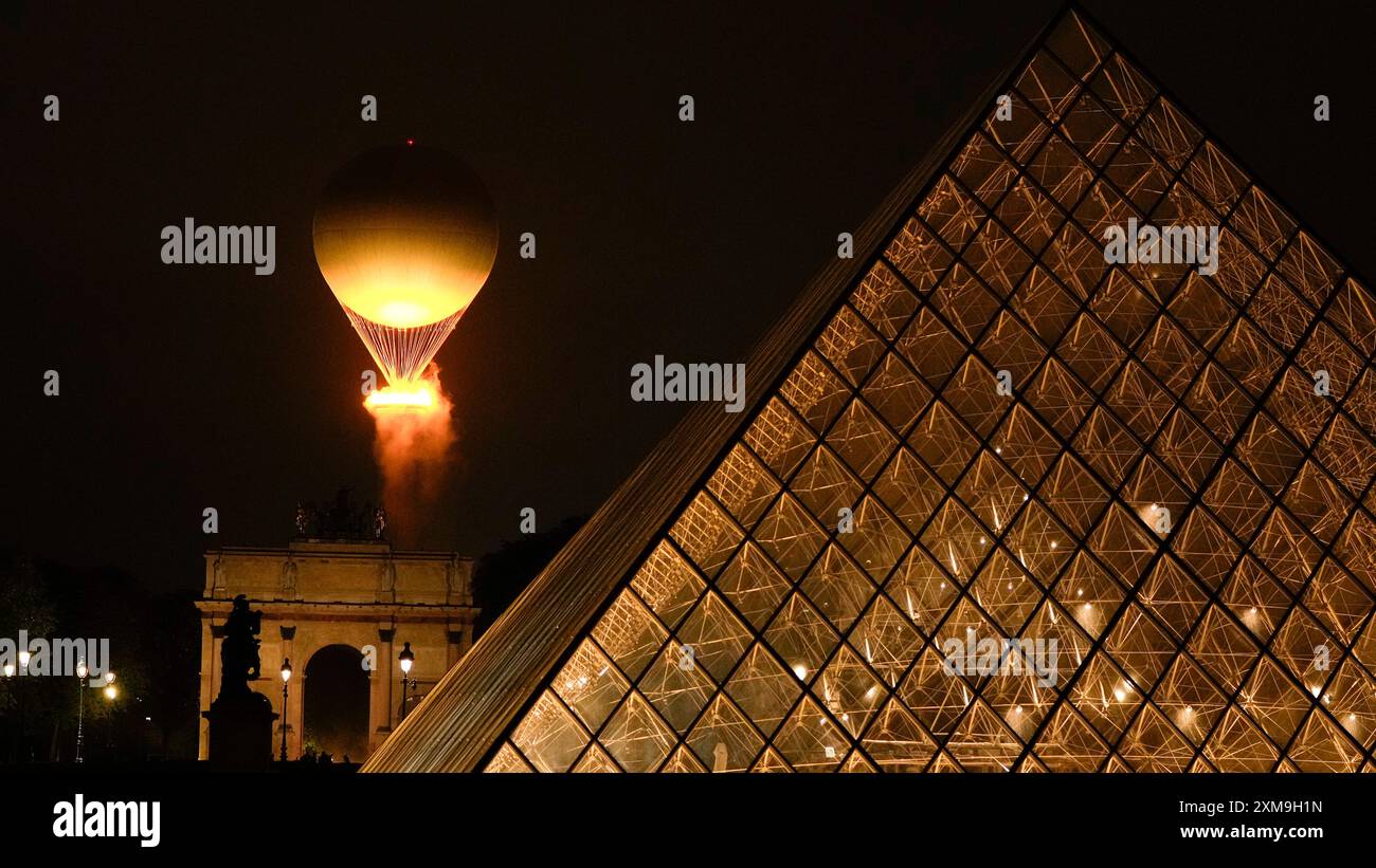 The Olympic Flame rises on a balloon after being lit in Paris, France ...