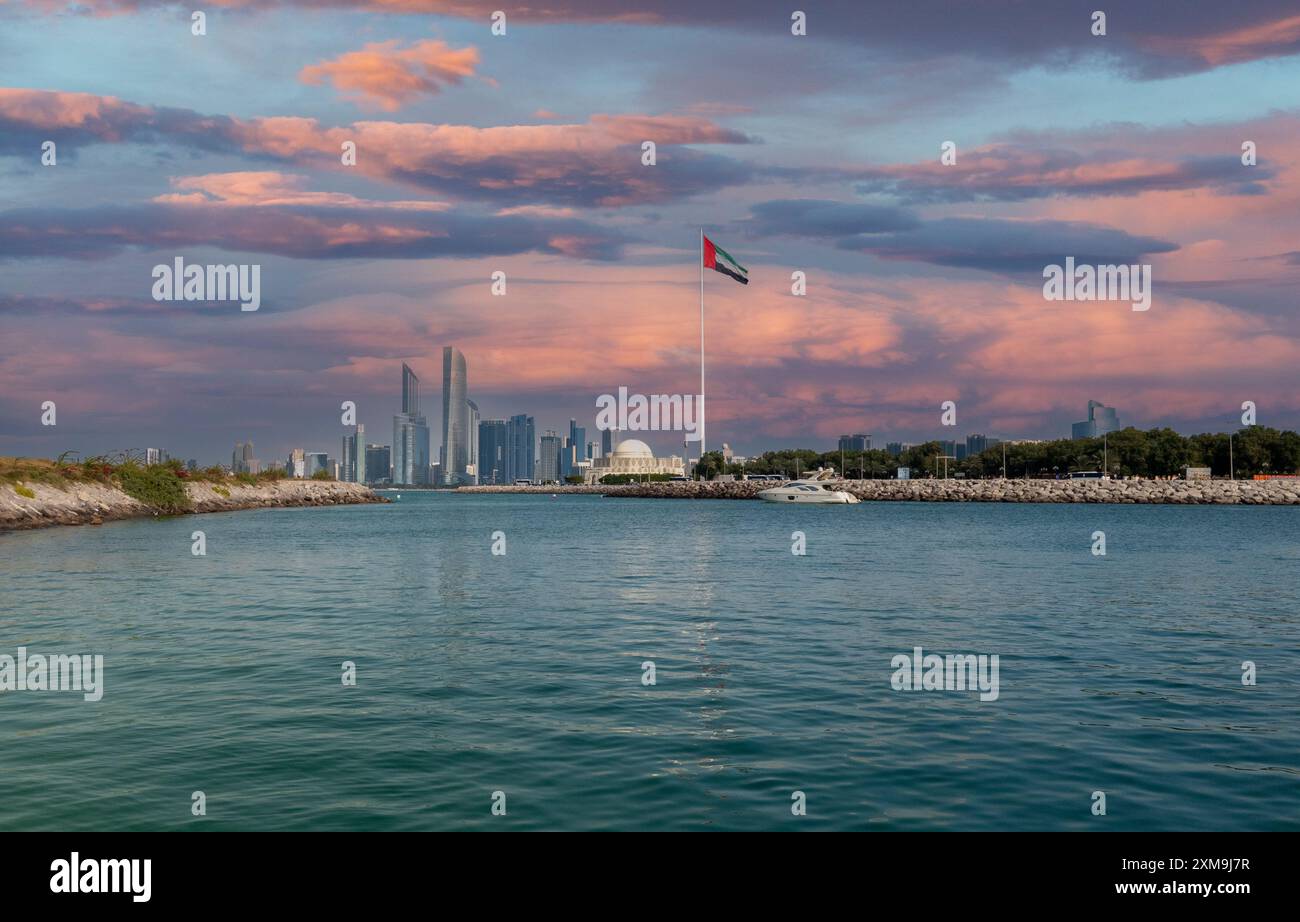 Abu Dhabi skyline and UAE flag , United Arab Emirates Stock Photo - Alamy