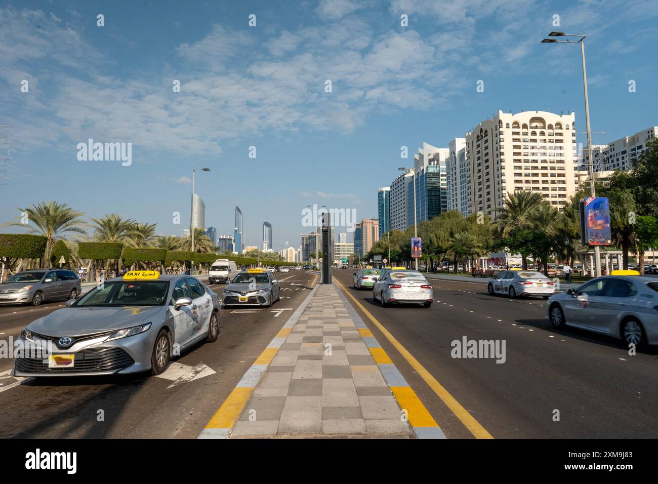 Street view of Corniche Road with with cityscpae of Abu Dahbi, United ...