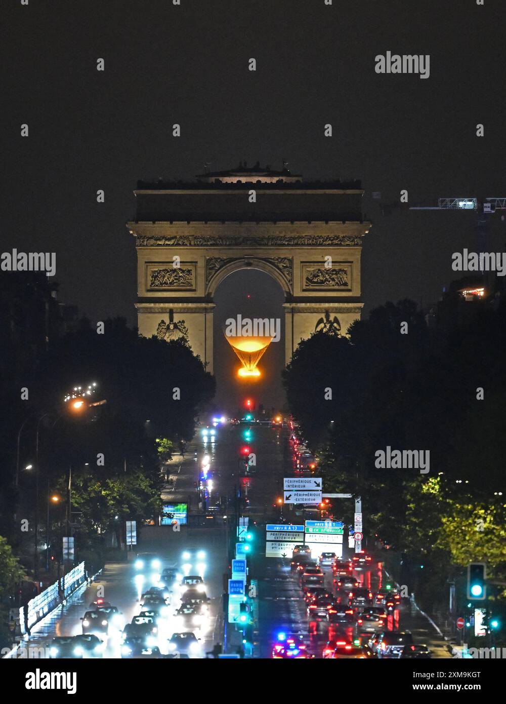 Paris, France. 26th July, 2024. A balloon carrying the lit Olympic ...