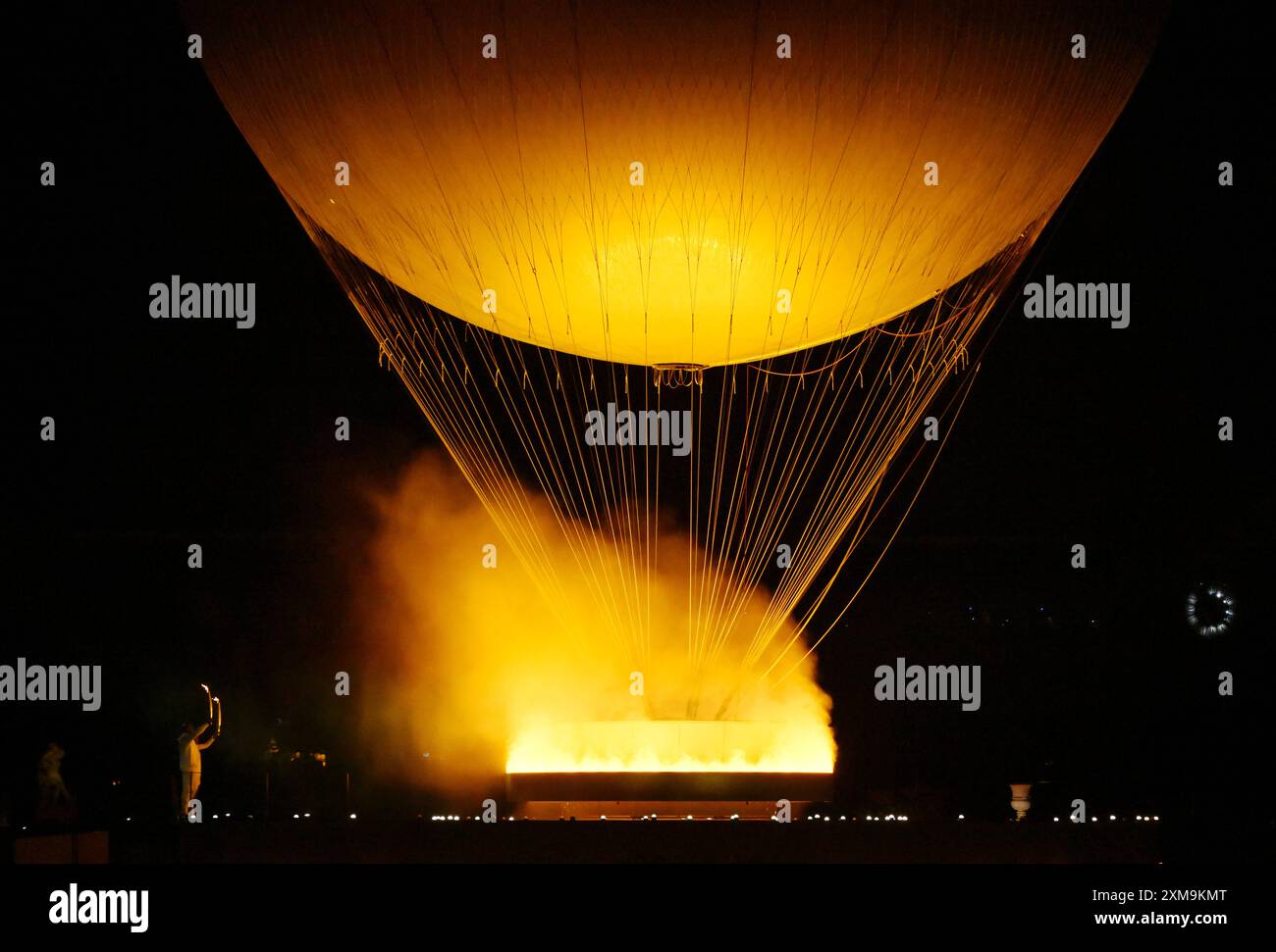 Paris, France. 26th July, 2024. The torchbearers French former sprinter ...