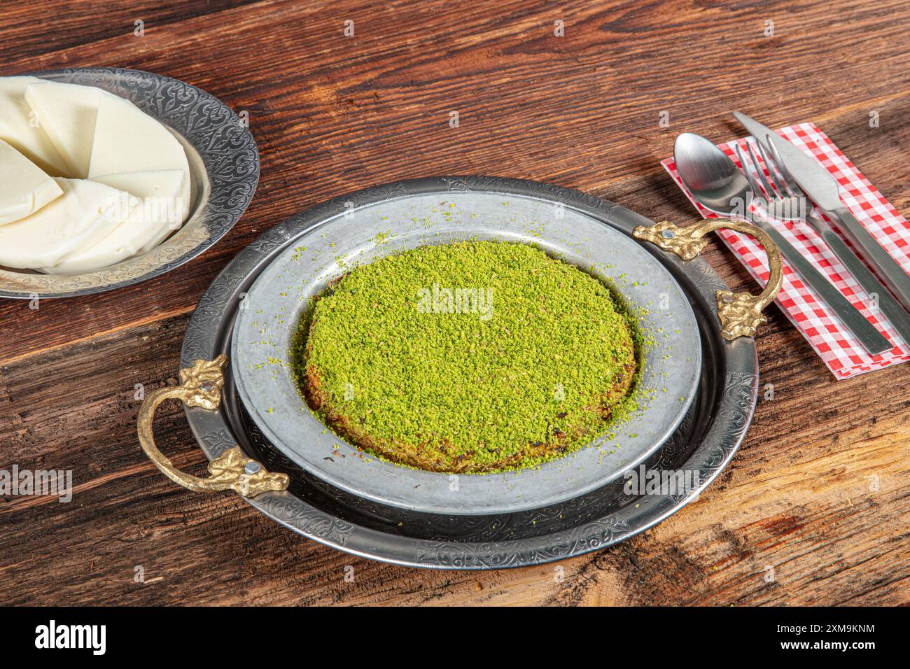 Turkish dessert kunefe, kunafa, kadayif with pistachio powder and ...