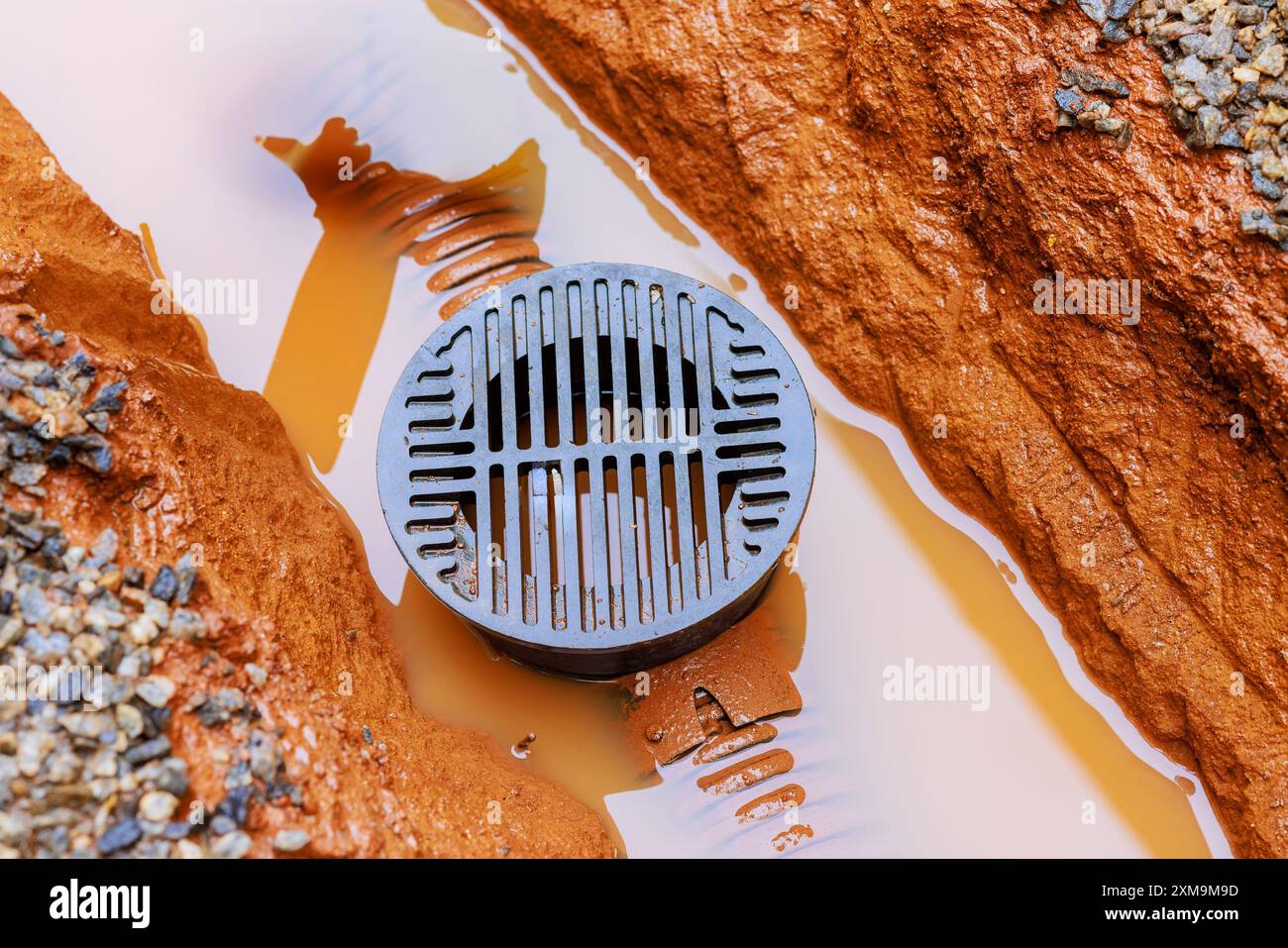 It is common for drainage trenches to flood with water during heavy ...