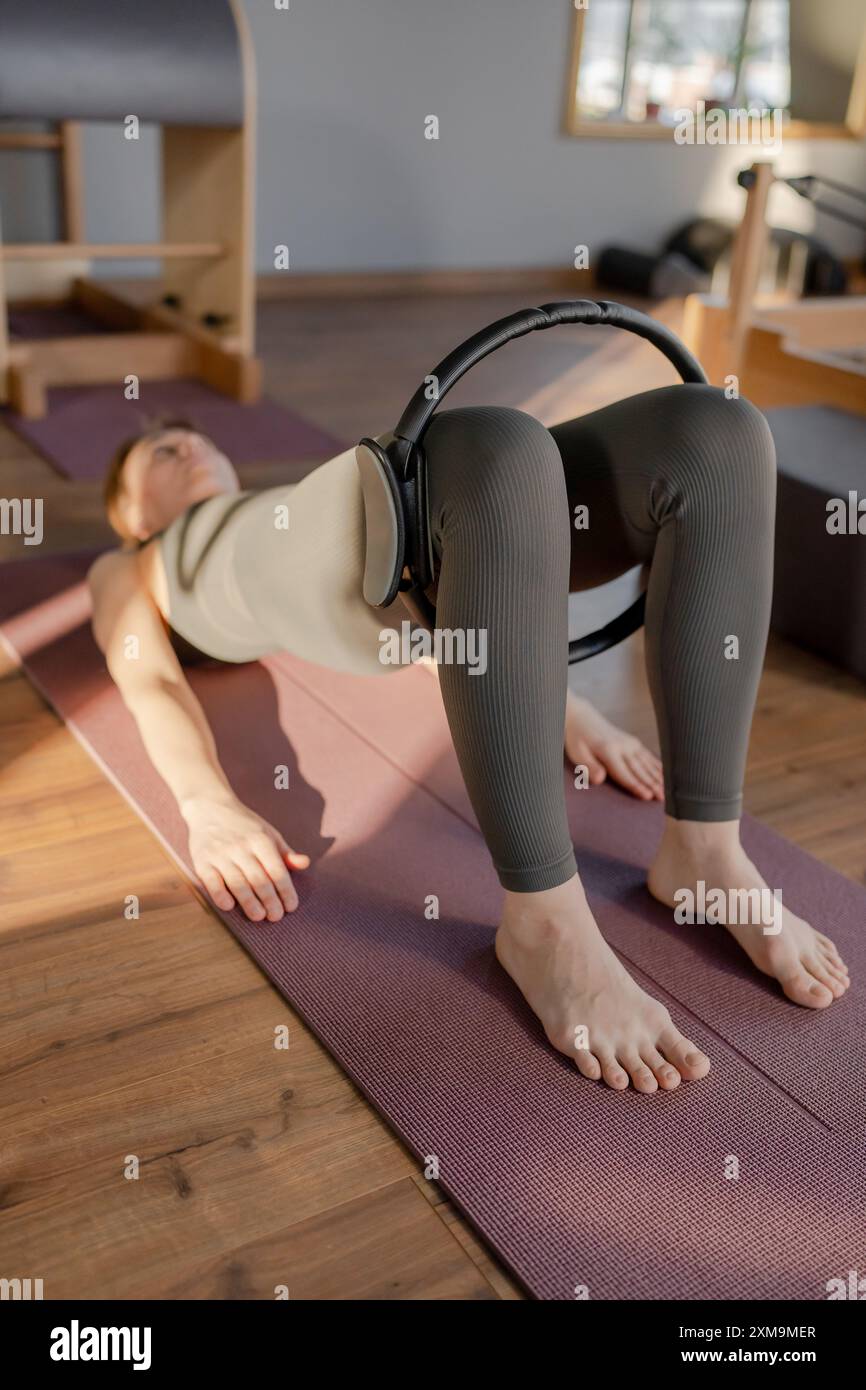 Glute bridge in pilates workout hi-res stock photography and images - Alamy