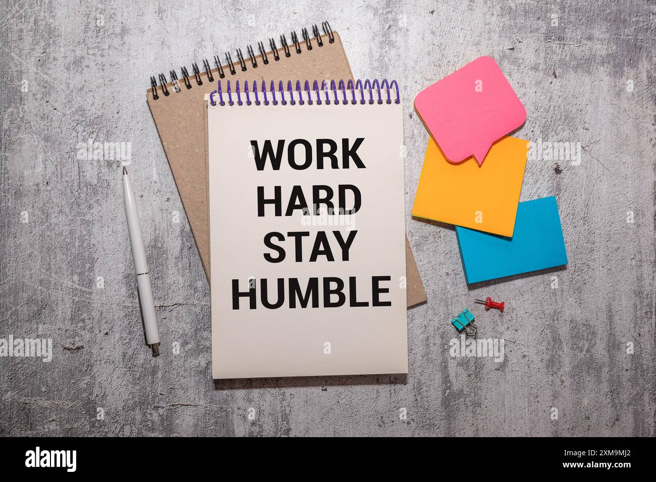 WORK HARD STAY HUMBLE text concept write on a notebook on wooden ...